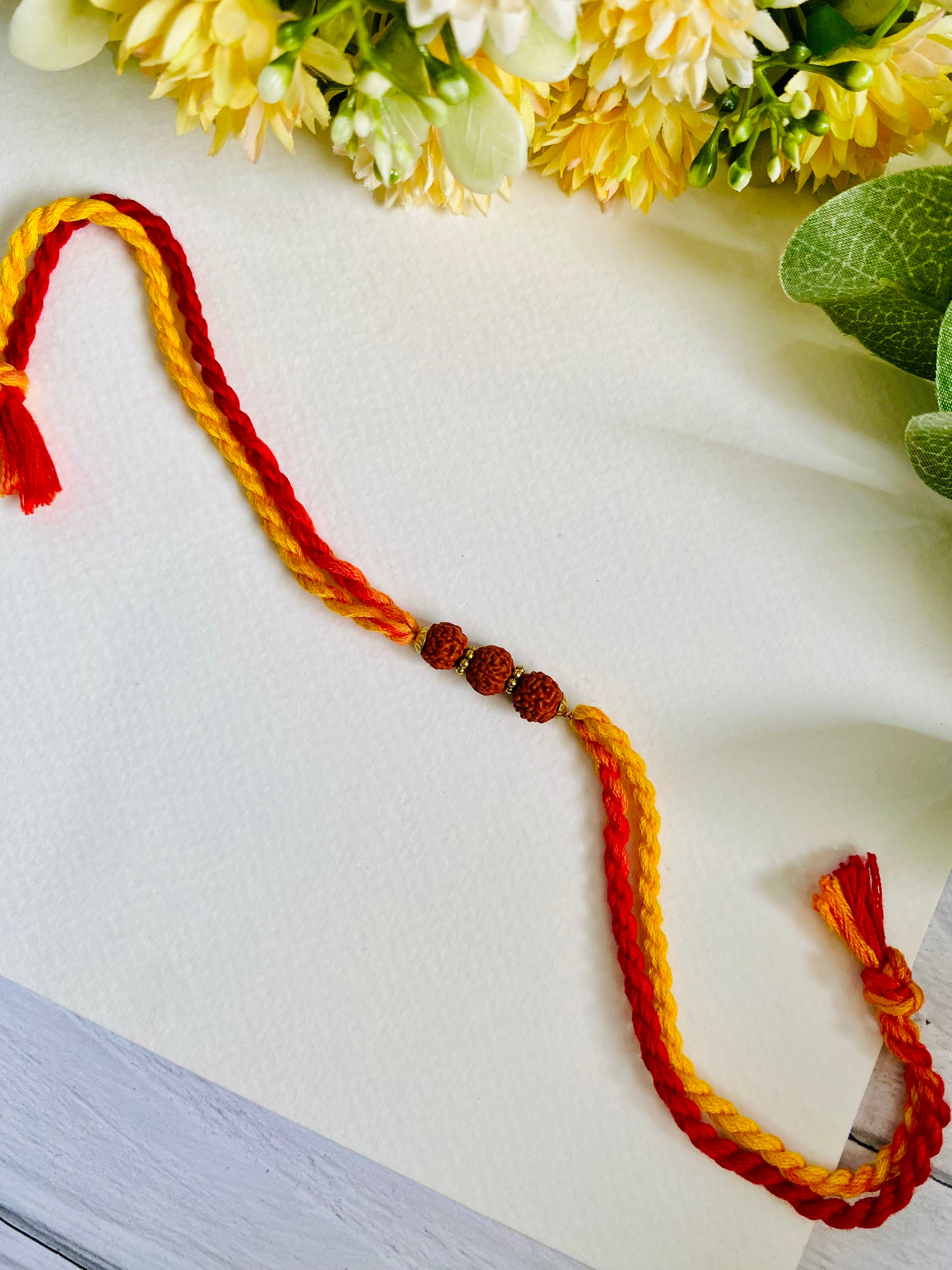 3 Rudraksha Red Yellow Bhai Rakhi – Madhurya Rakhi
